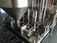 China Automatic Liquid Filling Machine Gas Flushing Cup Sealer 6 Cups Cycle for Food Packaging for sale