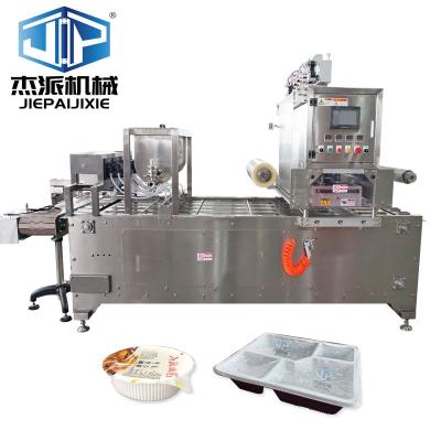 China PLC Control Automatic Tray Sealing Machine 40 Trays Per Minute Stainless Steel for sale