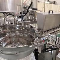 China Automatic Oat Cap Measuring Cup Quantitative Filling Sealing Machine With Spoon Feeding for sale
