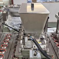 China Automatic Oat Cap Measuring Cup Quantitative Filling Sealing Machine With Spoon Feeding for sale