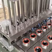 China Automatic Oat Cap Measuring Cup Quantitative Filling Sealing Machine With Spoon Feeding for sale