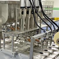 China Automatic Plastic Tray Filling and Sealing Machine 2400 Trays per Hour for Seafood for sale
