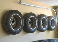 China Alternative Space Saving Hook Wall Mount Heavy Duty Tire Rack Wheel Storage Metal Rack for sale