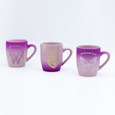 China Dia 8.4*6.3cm 10.2cmH 340ml souvenir coffee mug with color spraying and decal fired for Liang Zhu enthusiasts for sale