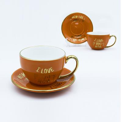 China Cup and saucer with golden pattern, rim and handle, are all made through electroplating special for mothers. for sale