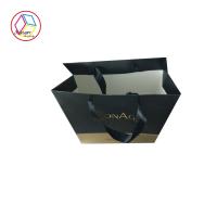 China Custom Logo Printed Paper Shopping Bags with Silk Handle 300gsm Coated Kraft for sale