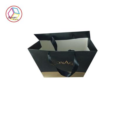 China Custom Logo Printed Paper Shopping Bags with Silk Handle 300gsm Coated Kraft for sale