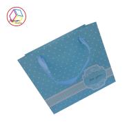 China Personalised Shopping Bags Blue Color Coated Paper Twisted Handle for sale