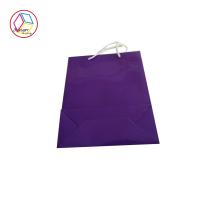 China Ivory Board Printed Paper Bags Varnish Surface With String for sale