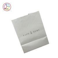 China Custom Eco Friendly Silver Foil Logo Handmade Paper Bags with Ribbon 310x435x280mm for sale