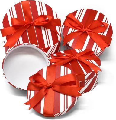 China Craft Christmas Round Nesting Gift Boxes With Lids 4 Pack Red And White For Candy Cookie for sale
