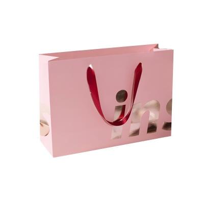 China Self Erecting Kraft Christmas Gift Bags Printed Branded Packaging Festival Gift Bags for sale