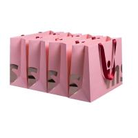 China Self Erecting Kraft Christmas Gift Bags Printed Branded Packaging Festival Gift Bags for sale