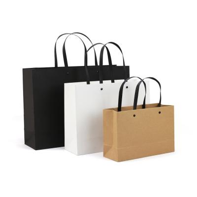 China OEM Kraft Paperboard Goodie Bags With Handles Retail Shopping Tote for sale