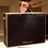 China Bulk Kraft Paper Bags Shopping Embossing Paper Gift Bag With Handles for sale