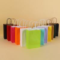 China Bulk Kraft Paper Bags Shopping Embossing Paper Gift Bag With Handles for sale