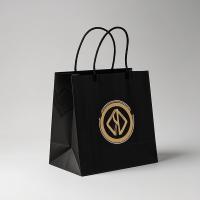 China Custom Printed Eco-Friendly Paper Gift Bags with Cotton Rope Handles for sale