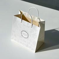 China Custom Printed Eco-Friendly Paper Gift Bags with Cotton Rope Handles for sale