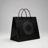 China Custom Printed Eco-Friendly Paper Gift Bags with Cotton Rope Handles for sale