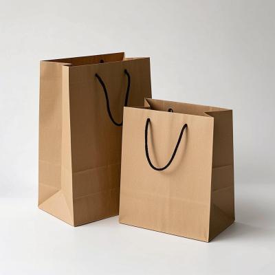 China Custom Kraft Paper Shopping Tote Bags with Cotton Rope Handles for sale