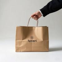 China Custom Kraft Paper Shopping Tote Bags with Cotton Rope Handles for sale