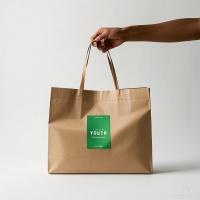 China Custom Kraft Paper Shopping Tote Bags with Cotton Rope Handles for sale