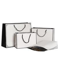 China Custom Luxury Fold Pattern Kraft Paper Bag 12x8in for Clothing Gifts for sale