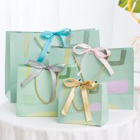 China Custom Luxury Fold Pattern Kraft Paper Bag 12x8in for Clothing Gifts for sale