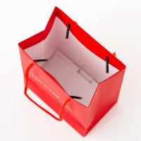 China Custom Recycled Art Paper Gift Bags 12x8x4in with Logo Printing for sale