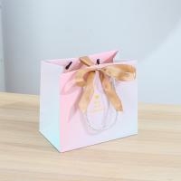 China Recycled Ivory Board Paper Shopping Bags 12x8x4in with Luxury Ribbon Rope for sale