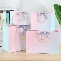 China Recycled Ivory Board Paper Shopping Bags 12x8x4in with Luxury Ribbon Rope for sale