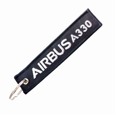 China Blank Custom logo Embroidery Fabric Woven Brand Airplane Jet Tag Key Ring Embroidered Airline Keychain for sale