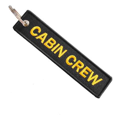 China Custom Cabin Crew Keychain - Black/Yellow Embroidery with Plane Design, Durable Polyester Webbing, Corporate Promo Gift for sale