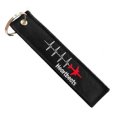 China Personalized Metal Key Ring Tag - ECG Plane Embroidery on Black Polyester / Waterproof Fabric & Pantone Color Options for sale