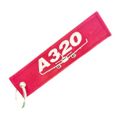 China Custom A320 Aircraft Keychain – Double-Stitched Polyester Fabric + Rust-Free Metal Hardware for sale