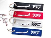 China Bold Boeing 737 Keychains: 3D Embroidery + Laser-Engraved Metal Rings for Aviation Enthusiasts for sale
