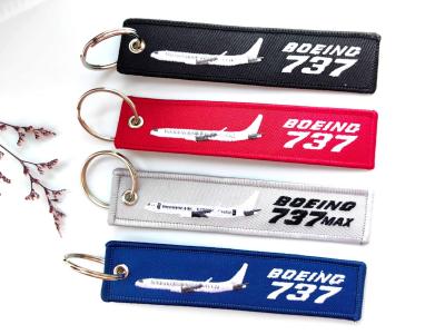 China Bold Boeing 737 Keychains: 3D Embroidery + Laser-Engraved Metal Rings for Aviation Enthusiasts for sale