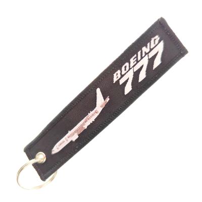 China Premium Aircraft Keychain with Dual Embroidery - Official Boeing 777 Design, Black/Blue/Red Metal Souvenir for Aviation Enthusiasts for sale