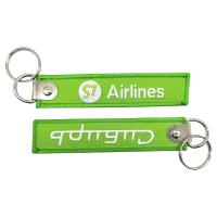 China Vibrant Green Custom Embroidered Keychain Double Stitch Metal Rings Flight Tags Keychain for sale