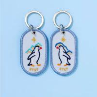 China Heartwarming Penguin Pair Keychains | Bespoke Keepsakes | Double-Sided Embroidery | Starry Gradient Fabric for sale