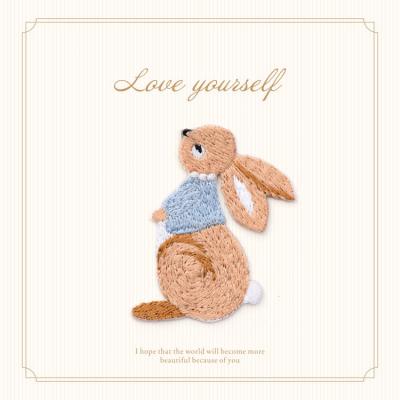 China Multi-Surface Magic Bunny Iron-On Patches Merrow Border Trendy Unique Express Customization 3D Clothing Embroidery Patch for sale