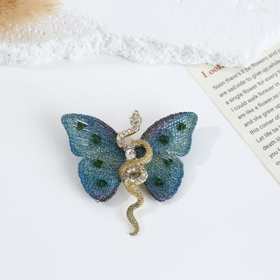 China Metallic Butterfly & Serpin Brooch - Handcrafted Blue Gradient Design with Personalization Options for sale