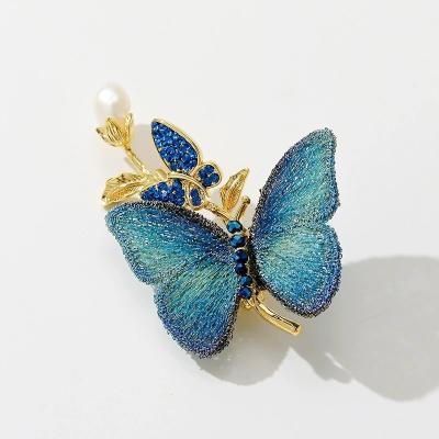 China Pin Closure Timeless Blue Butterfly Jewelry Pearl Gold Detailing for Bridal Gifts Everyday Glam for sale