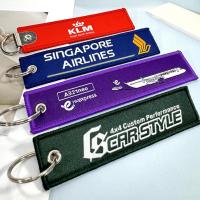 China Custom Double Sided Jet Key Tag Carved Logo Embroidery Keychain Woven Label Fabric Blank Keychains Promotional Jet Carabiners for sale