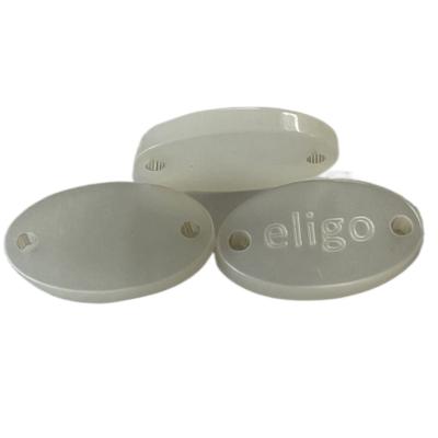 China Custom Logo Off White Ellipse Fancy Plastic Buttons 18L to 80L Sew On for Garment DIY for sale