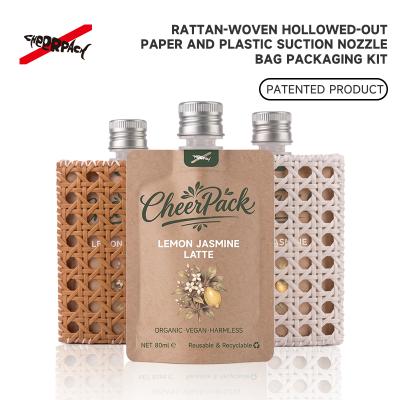China Reusable Rattan Woven Spout Pouch with Aluminum Cap | CheerPack Patented 100ml rattan-woven hollow-out spout pouch with reusable Sleeve and aluminum screw cap. Eco cosmetic packaging, OEM/ODM welcome. for sale