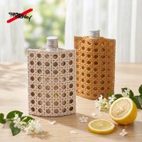 China Reusable Rattan Woven Spout Pouch with Aluminum Cap | CheerPack Patented 100ml rattan-woven hollow-out spout pouch with reusable Sleeve and aluminum screw cap. Eco cosmetic packaging, OEM/ODM welcome. for sale