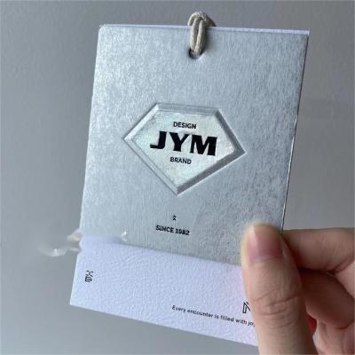 China Custom Anti-Counterfeit Kraft Paper Hang Tags - 500pcs MOQ with 5-7 Day Delivery for Brand Protection Labels for sale
