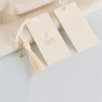 China Custom Embossed Eco-Friendly Clothing Hangtags - Recycled Paper Labels with 500pcs MOQ and 5-7 Day Production for sale