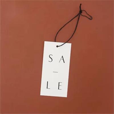 China Custom Clothing Labels with String & Safety Pins - Black Paper Price Tags 500pcs Minimum Order 5-7 Day Delivery for sale
